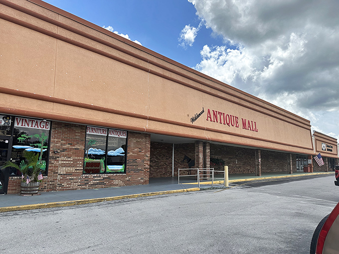 The full façade of Wildwood Antique Mall stretches across the shopping center like a time portal waiting to transport curious shoppers to decades past.