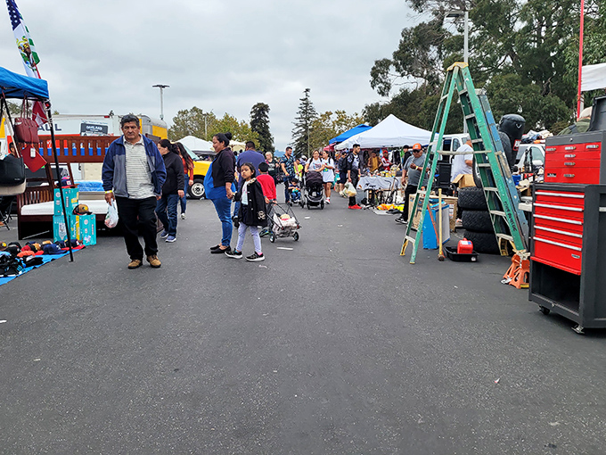 The weekend treasure hunt begins! Shoppers navigate the bustling aisles of Laney College Flea Market, where one person's castoffs become another's prized discoveries.