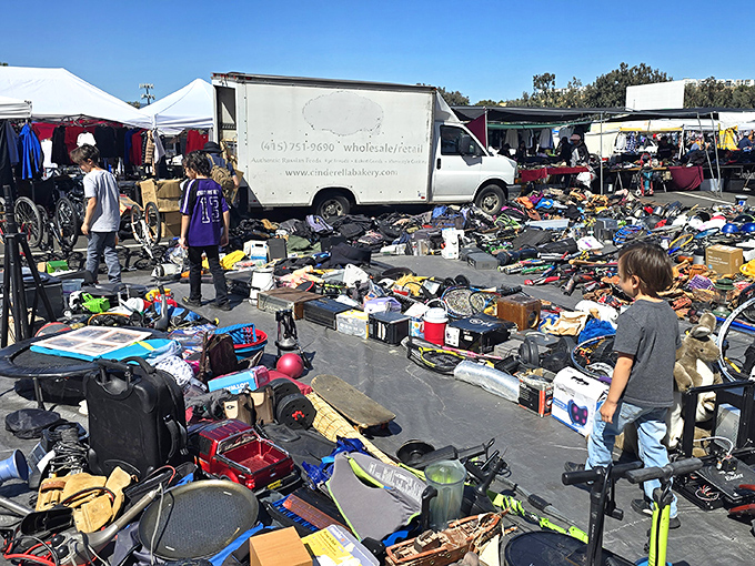 Tools and all sorts of goods line the walkways at San Jose Capitol Flea Market, creating a bustling corridor of bargains and weekend energy under the perfect California sky.