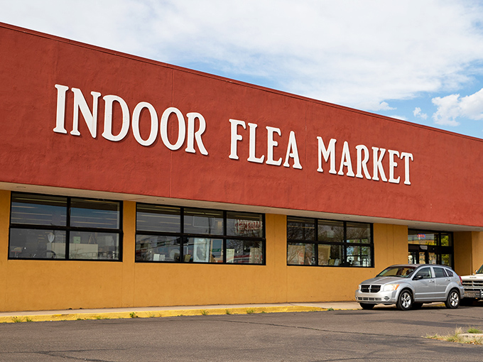 The iconic red and yellow facade of the Other Indoor Flea Market stands like a beacon for treasure hunters on Central Avenue in Albuquerque.
