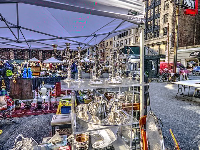 Silver treasures catching the morning light, where Manhattan's skyline serves as the perfect backdrop for vintage hunting adventures.