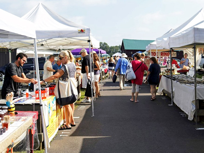 White canopy tents line the pathways at Rice's Market, creating a bazaar atmosphere where treasure hunters navigate between stalls of possibility.