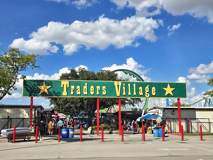 The iconic green and yellow entrance to Traders Village stands like a portal to bargain heaven, complete with Texas stars announcing you've arrived somewhere special.