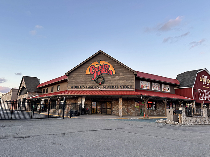 The rustic wooden facade of Country Junction stands proudly against a blue Pennsylvania sky, promising adventures that'll make your credit card weep with joy.