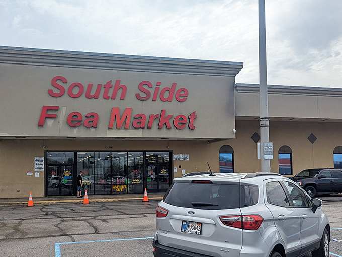 The iconic red signage of South Side Flea Market beckons treasure hunters like a lighthouse for bargain-seeking ships in the retail sea.