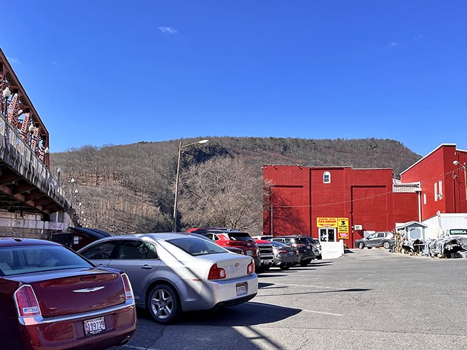 The striking red exterior against Cumberland's mountain backdrop promises adventures in antiquing before you even park your car.