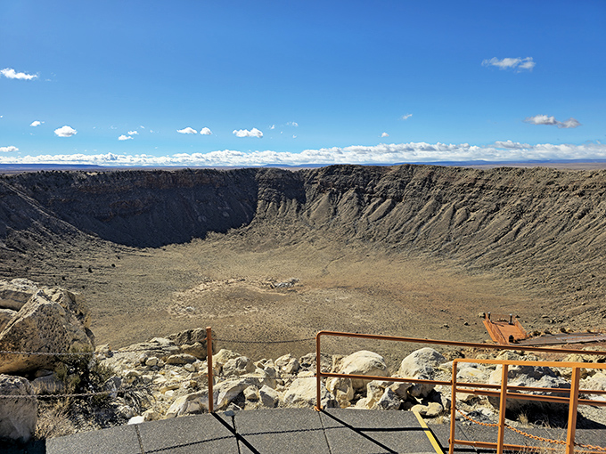 Nature's perfect punch bowl stretches nearly a mile wide, reminding us we're just cosmic dust bunnies in the grand scheme of things.