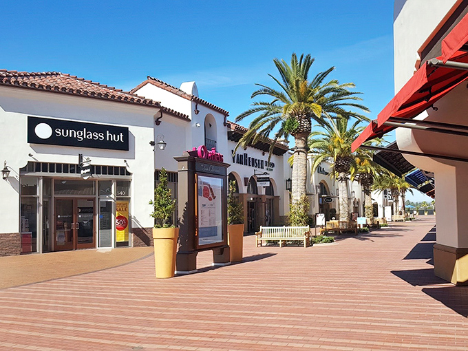 Palm trees and Spanish-style architecture create a shopping paradise that feels more like a Mediterranean resort than a bargain hunter's playground.