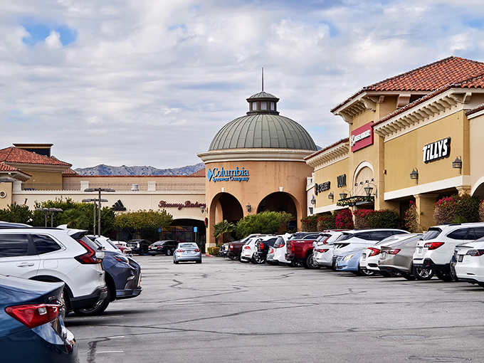 The iconic domed entrance of Columbia Sportswear welcomes shoppers like a retail oasis in the desert landscape.