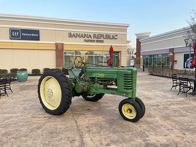 A vintage John Deere tractor parked outside Gap and Banana Republic &ndash; where farm charm meets fashion in a uniquely Georgian retail mashup.