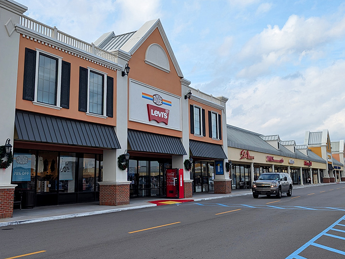 The classic architecture of Tanger Outlets in Gonzales welcomes shoppers with its distinctive peach fa&ccedil;ade and Levi's storefront.