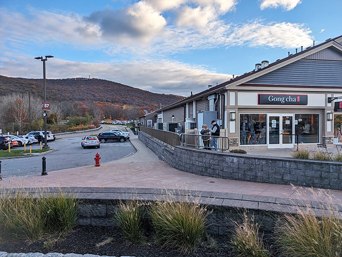 New England charm meets retail therapy heaven. Woodbury Common's picturesque setting against the Hudson Valley hills makes bargain-hunting feel positively bucolic.