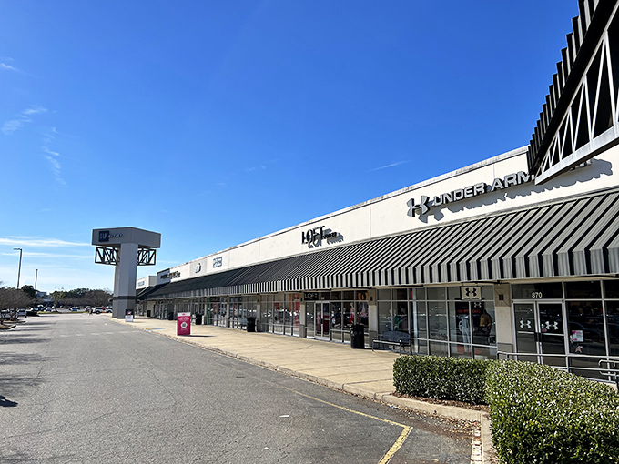 The sprawling exterior of Carolina Premium Outlets beckons shoppers with the promise of designer deals under the bright North Carolina sky.