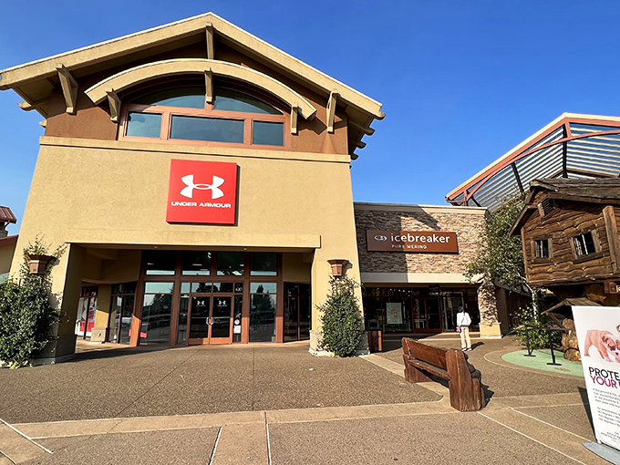 Under Armour's storefront beckons with promises of athletic gear at prices that won't make your credit card file for protective custody.
