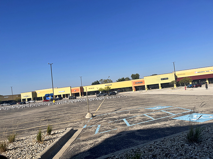 Like sentinels of savings, these storefronts stand ready to welcome bargain hunters with their earth-toned facades and red awnings.