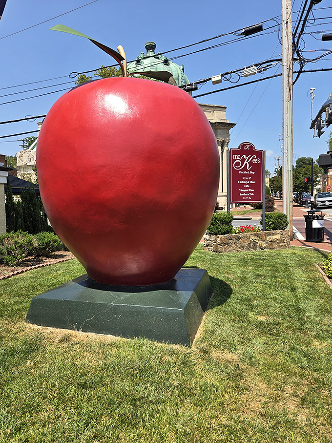 The crimson giant stands proudly against Winchester's historic skyline, like a fruit that escaped from a giant's picnic basket.