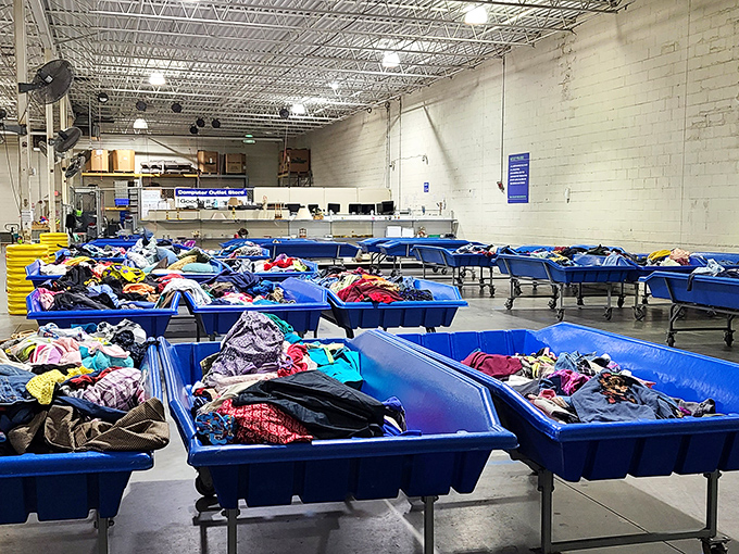 Blue bins as far as the eye can see, each one a potential goldmine of fashion treasures waiting for their second chance at greatness.