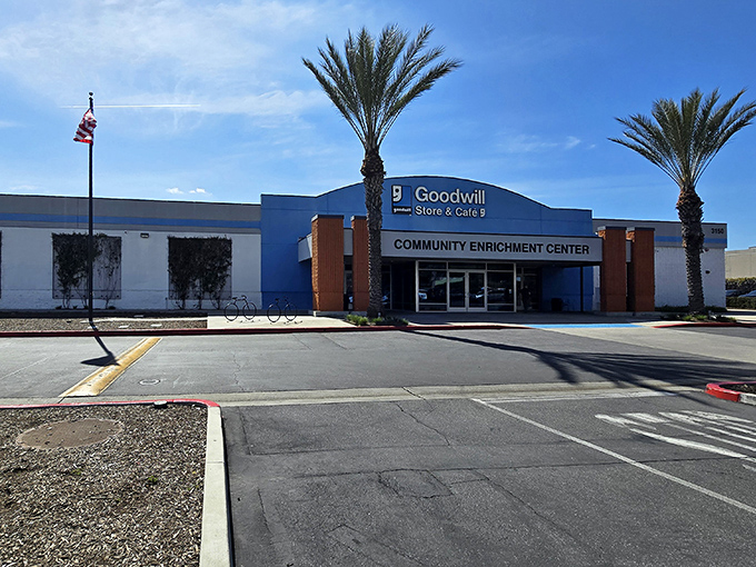 The blue-fronted Community Enrichment Center beckons like a retail oasis in the desert of full-price shopping. Palm trees included, no extra charge!