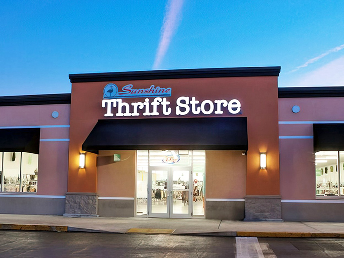 The coral-colored facade of Sunshine Thrift Store beckons like a Florida sunset, promising treasures inside that won't break the bank.