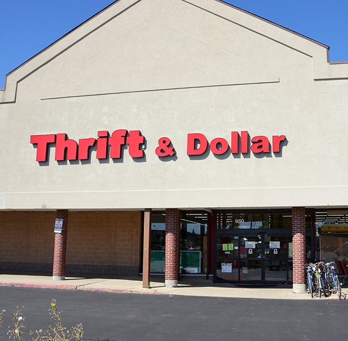 The bold red signage of Thrift & Dollar Inc promises adventure within&mdash;like a beacon for bargain hunters navigating the seas of retail markup.
