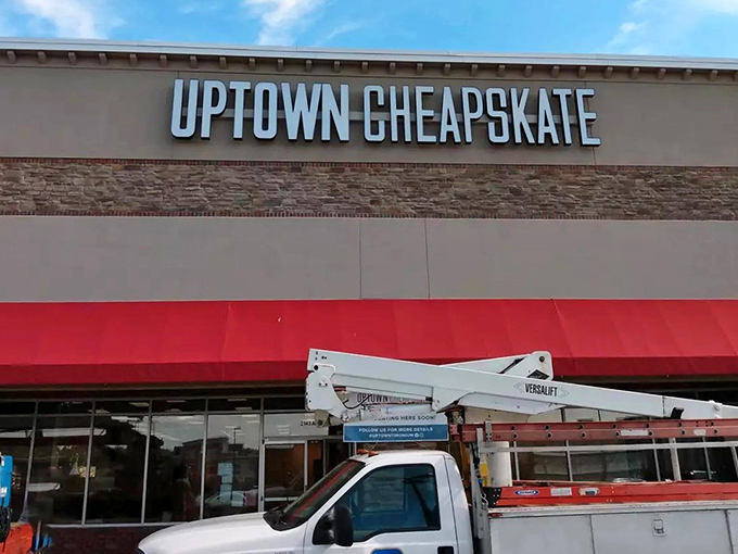 The storefront beckons like a fashion oasis in the suburban desert. That bold red awning is basically a superhero cape for your wallet.
