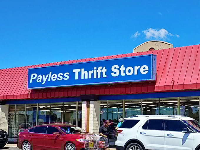 The iconic red-roofed Payless Thrift Store beckons bargain hunters like a retail lighthouse guiding ships to treasure-filled shores.