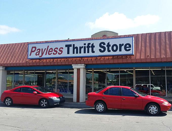 The iconic red-roofed Payless Thrift Store beckons bargain hunters like a retail lighthouse guiding ships to treasure-filled shores.
