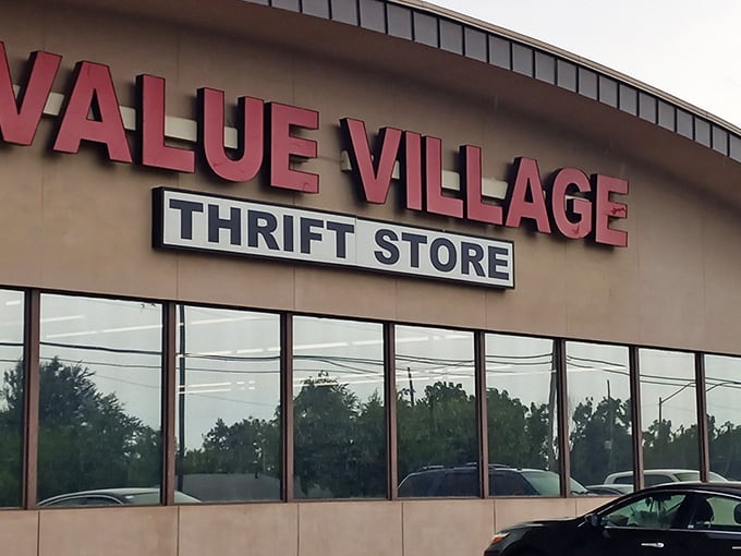 The iconic red signage of Value Village beckons like a lighthouse for bargain hunters navigating the sea of retail sameness.