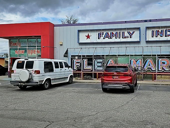 The red and silver exterior of Family Indoor Flea Market stands like a treasure chest in the Albuquerque sun, promising adventures in vintage hunting within.