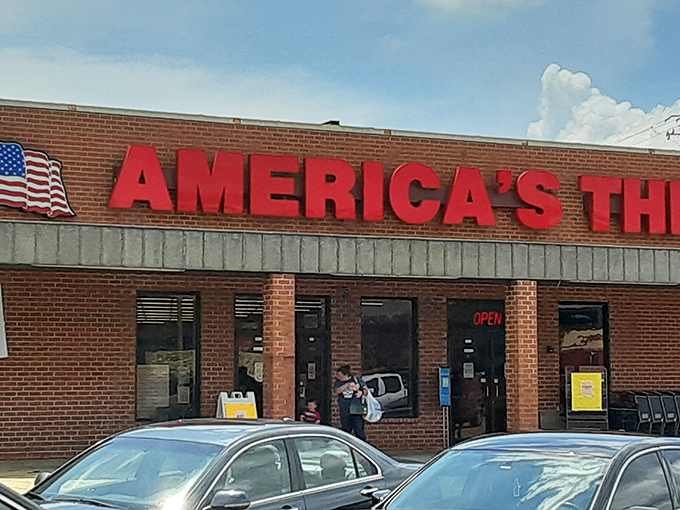 The bold red letters of America's Thrift Store beckon like a siren song to bargain hunters. No fancy frills, just the promise of treasures waiting inside.
