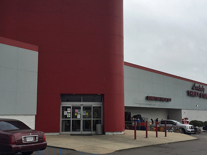 The unmistakable red exterior of Lovelady Thrift Store stands like a beacon of bargain-hunting hope against the Alabama sky, promising treasures within.