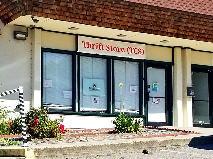 A closer look at Thrift City's storefront with its distinctive cedar-shingled roof. The modest fa&ccedil;ade keeps the best secrets.