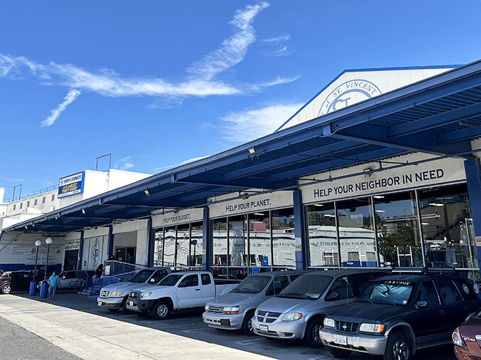 The blue-trimmed facade promises treasure hunting with purpose: "Help Your Planet. Help Your Neighbor in Need." Shopping with a conscience never looked so inviting.