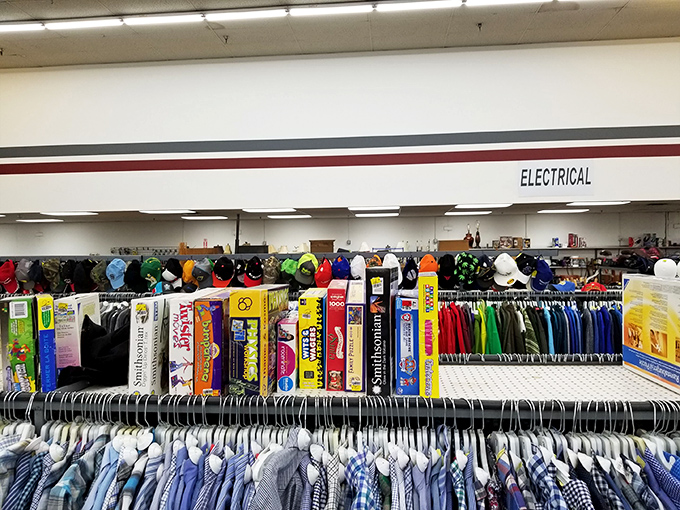 Racks of men's shirts, jackets, and caps line the aisles, while shelves of board games and books await their next admirer.