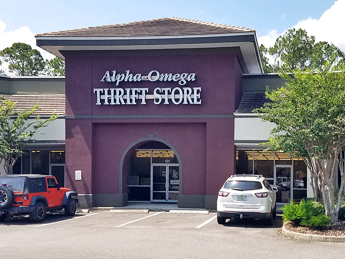 The purple facade of Alpha-Omega stands like a portal to bargain heaven. Your wallet's happy place awaits inside.