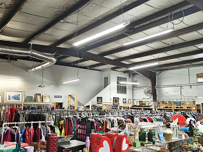 A treasure hunter's paradise awaits under these industrial beams, where racks of potential discoveries stretch as far as the eye can see.