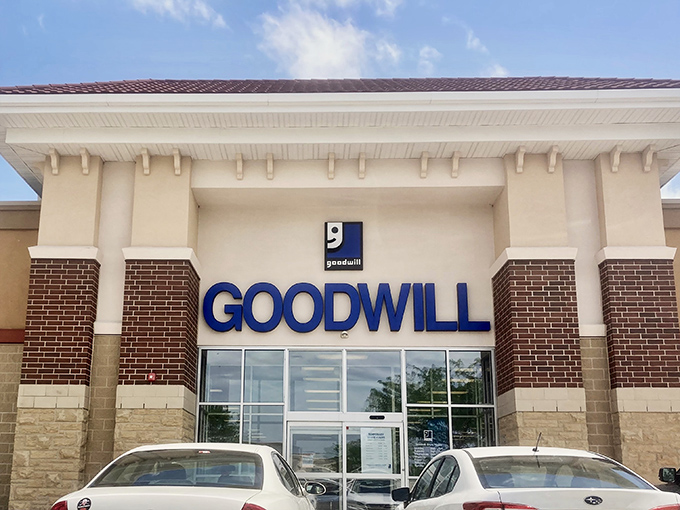 The welcoming facade of Goodwill in West Des Moines stands ready to embrace treasure hunters with its promise of unexpected discoveries behind those glass doors.