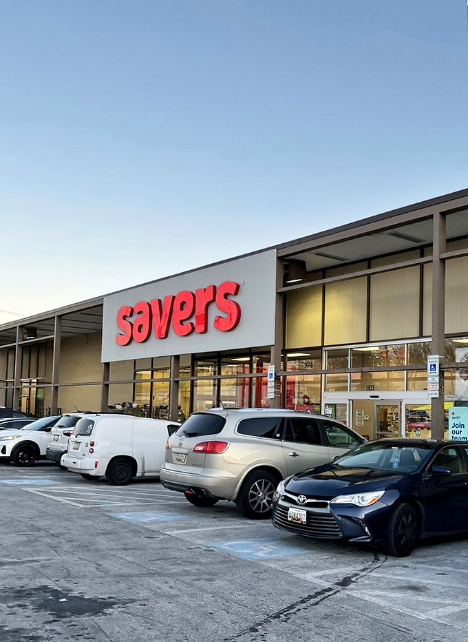 The iconic red Savers sign beckons like a lighthouse for bargain hunters. Your wallet's happy place awaits inside these doors.