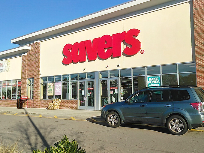 The iconic red Savers sign beckons like a lighthouse for bargain hunters, promising shores lined with secondhand treasures waiting to be discovered.