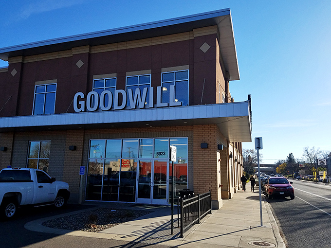 The modern brick exterior of Goodwill on Nicollet Avenue stands like a temple to thrift, beckoning bargain hunters with promises of treasures within.