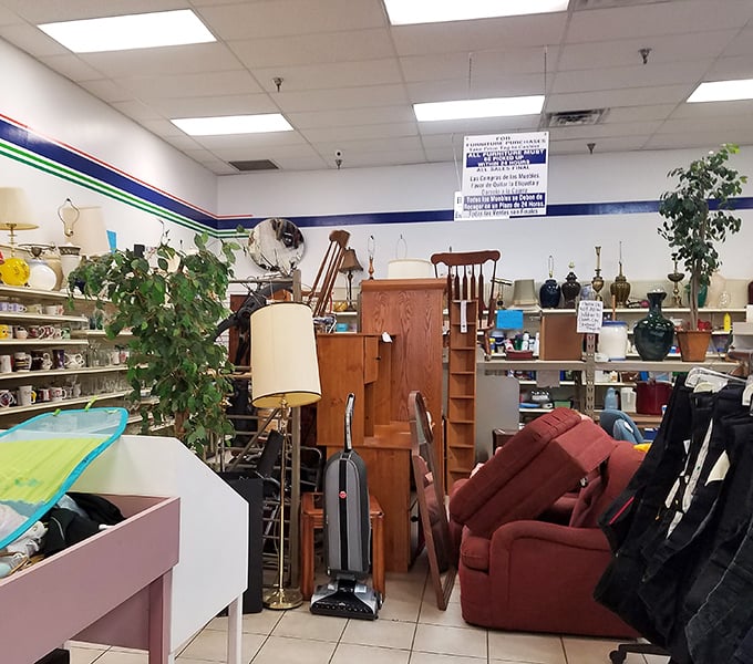 The furniture section at Grand Island Goodwill showcases a treasure trove of potential - from wooden shelves to comfy couches waiting for their second chance.