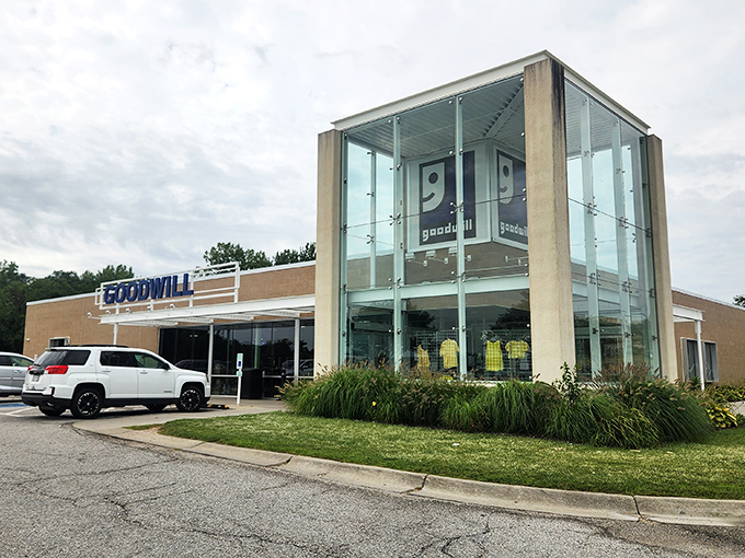 The modern glass entrance of Bellevue's Goodwill beckons like a retail oasis, complete with that iconic smiling logo promising treasures within.