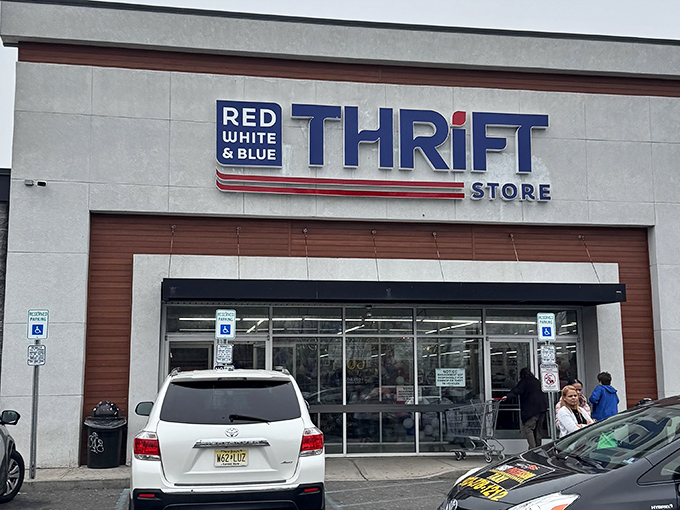 The patriotic facade of Red White & Blue Thrift Store beckons bargain hunters with its bold signage and promise of treasures within.