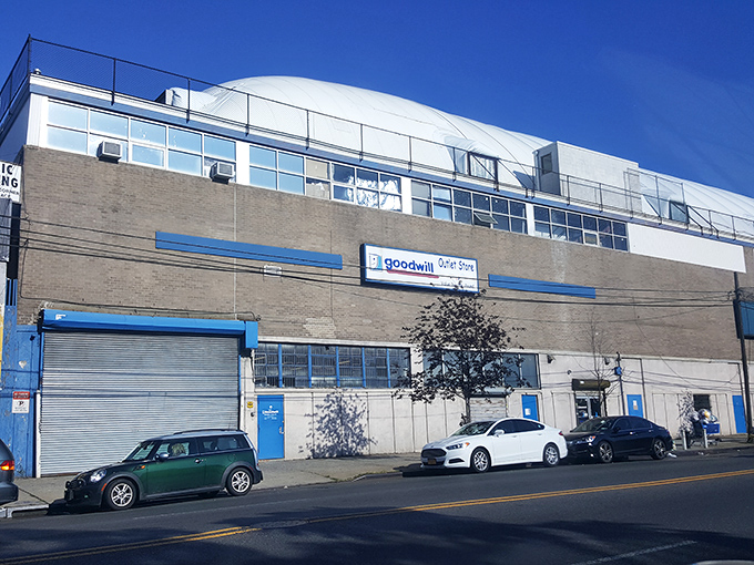 The unassuming exterior of Goodwill's Van Dam Street outlet belies the treasure trove within. Like a speakeasy for bargain hunters, you'd never guess what awaits inside.