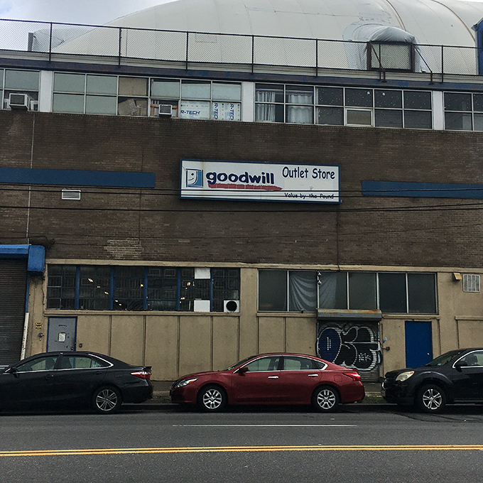The unassuming exterior of Goodwill's Van Dam Street outlet belies the treasure trove within. Like a speakeasy for bargain hunters, you'd never guess what awaits inside.