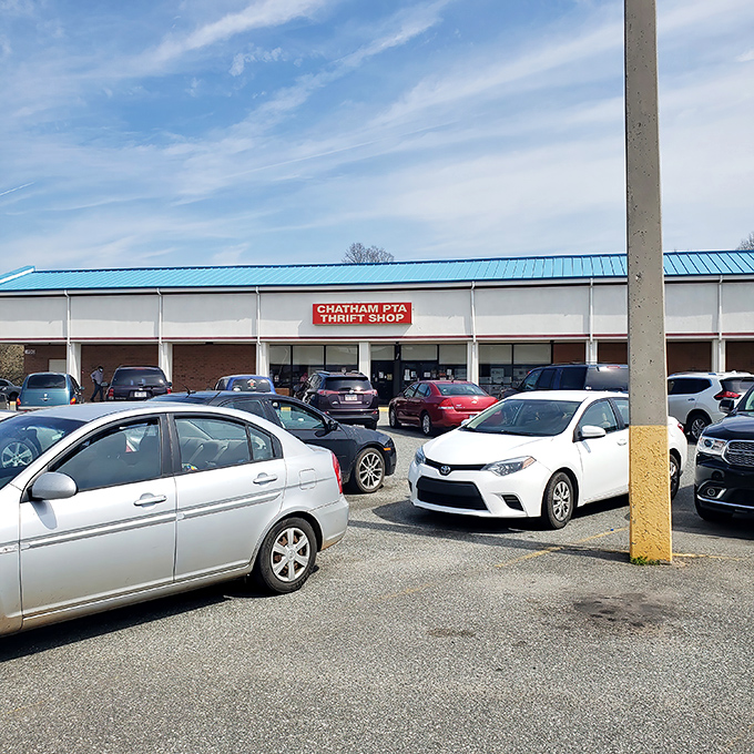 The iconic red sign against the blue roof is like a beacon for bargain hunters. This unassuming storefront houses treasures waiting to be discovered.