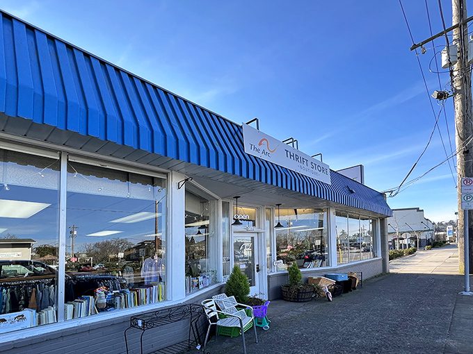 The Arc's cheerful blue awning beckons treasure hunters like a beacon of bargain possibilities. Step inside&mdash;your next conversation piece awaits.