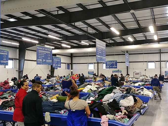 Treasure hunting in full swing! The Reading Goodwill Outlet buzzes with shoppers sifting through blue bins, each hoping to unearth that perfect find.