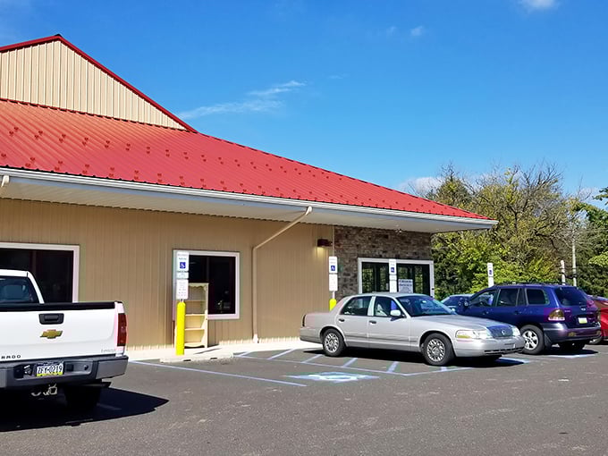 The donation drop-off area buzzes with activity as yesterday's memories become tomorrow's discoveries under that unmistakable crimson roofline.