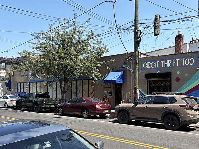 The unassuming storefront of Circle Thrift beckons with colorful signage and the promise of treasures waiting to be discovered inside.